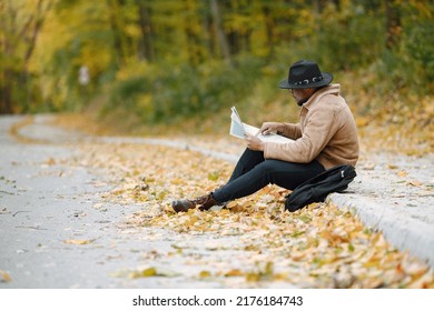 Man Sitting On Road Looking Map Stock Photo 2176184743 | Shutterstock