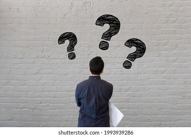Man Staring Wall Looking Question Marks Stock Photo 1993939286 ...