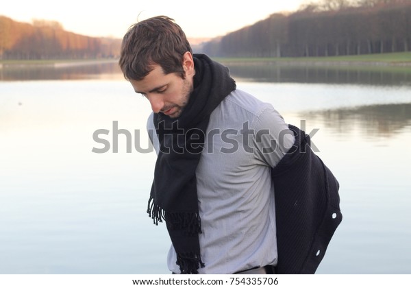 Man Taking Jacket Off Stock Photo (Edit Now) 754335706