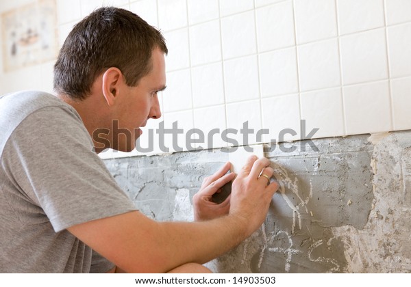 Man Tiling Wall Kitchen Stock Photo 14903503 | Shutterstock
