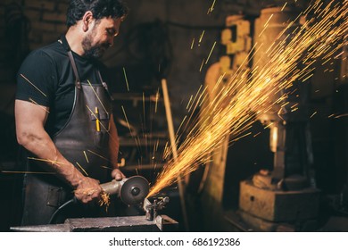 Стоковая фотография 686192386: Man Using Angle Grinder Sparks ...