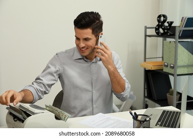 Man Using Banknote Counter While Talking Stock Photo 2089680058 ...