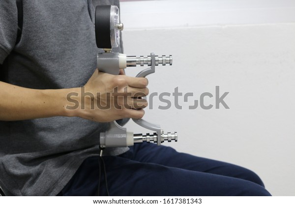 Man Using Grip Strength Dynamometer Testing Stock Photo 1617381343 ...