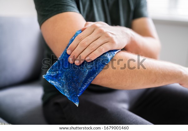 Man Using Ice Gel Pack On Stock Photo (Edit Now) 1679001460