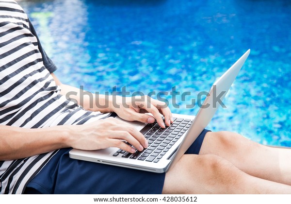 Man Using Laptop Pool On Vacation Stock Photo (Edit Now) 428035612