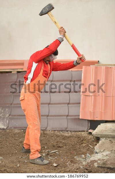 Man Using Sledgehammer Stock Photo 186769952 | Shutterstock