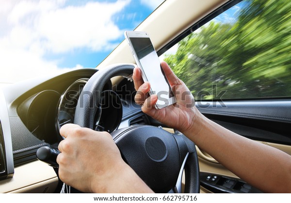 Man Using Smartphone While Driving Car Stock Photo 662795716 | Shutterstock