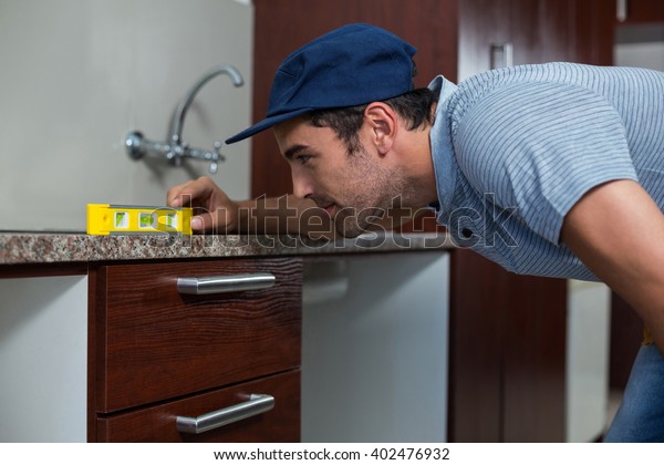 Man Using Spirit Level While Bending Stock Photo 402476932 | Shutterstock