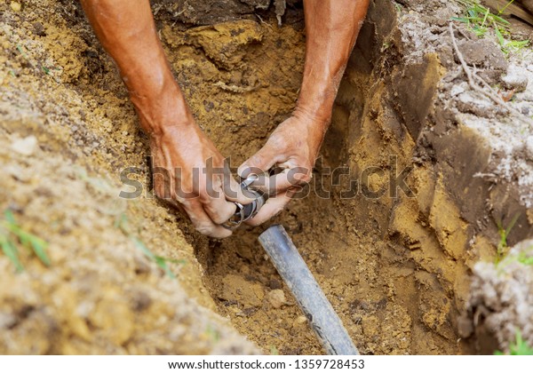 Man Working Pipes Ground While Installing Stock Photo 1359728453 ...