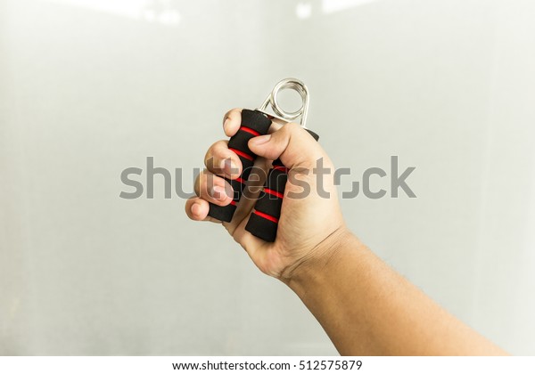 Mans Hand Squeezing Hand Coil Exercise Stock Photo (Edit Now) 512575879