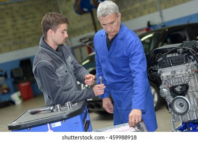 Mechanic Helping Apprentice Fix Engine Stock Photo 459988918 | Shutterstock