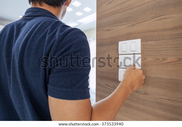 Men Switching Off Light Saving Concept Stock Photo 373533940 | Shutterstock