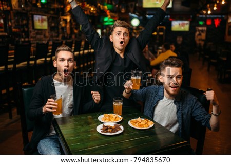 Men at the Table with Beer Crisps and Crackers Image - cg7p94835670s