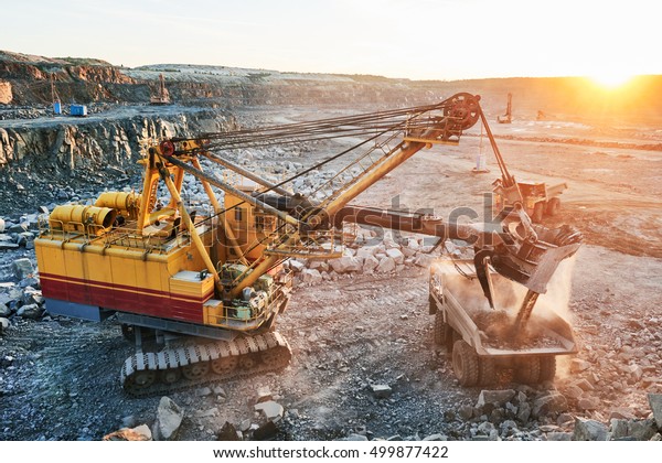 Mining Excavator Loading Granite Ore Into Stock Photo (Edit Now) 499877422
