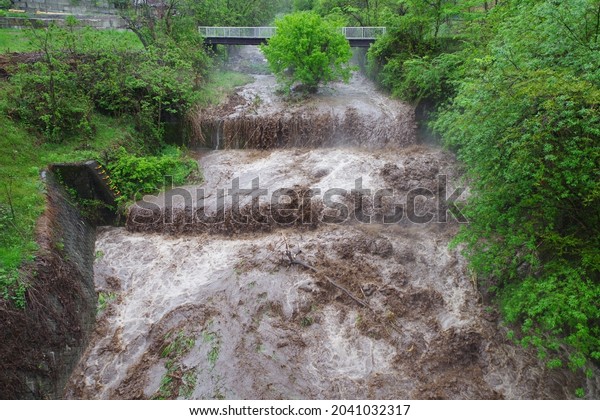 Muddy Stream Flowing Through Wellmaintained Mountain Stock Photo ...