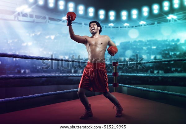 Muscular Asian Male Boxer Throwing Uppercut Stock Photo (Edit Now ... Muscular Asian Male Boxer Throwing Uppercut Stock Photo (Edit Now ...