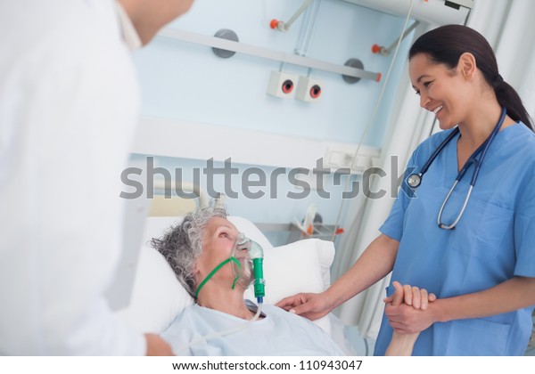 Nurse Smiling Patient While Touching Her Stock Photo (Edit Now) 110943047