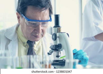 Young Scientist Looking Through Microscope Laboratory Stock Photo ...
