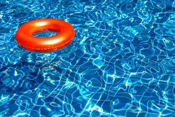 Orange pool float featuring beach, pool, and safe, a Sports ...