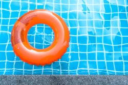 Orange pool float featuring beach, pool, and safe, a Sports ...