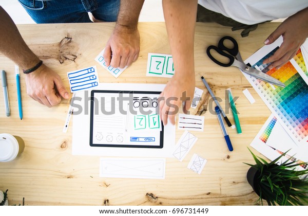 Overhead View Hands Designing Wireframe On Stock Photo 696731449 ...
