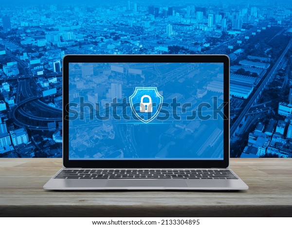 Padlock with shield flat icon on modern laptop computer monitor screen ...