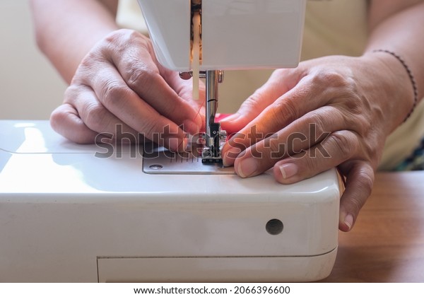 Pair Hands Pulling Thread On Sewing Stock Photo (Edit Now) 2066396600