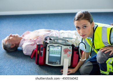 Paramedic Using External Defibrillator During Cardiopulmonary Stock ...