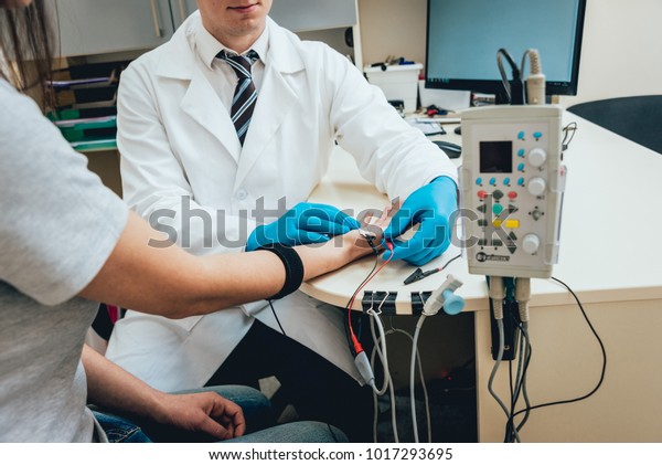 Patient nerves testing using electromyography. Medical examination. EMG