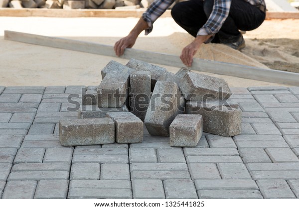 Paving Stone Worker Putting Down Paver Stock Photo (Edit Now) 1325441825 Paving Stone Worker Putting Down Paver Stock Photo (Edit Now) 1325441825