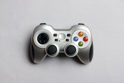 Brandless gaming controller sits in, a Technology Photo by Piranhi