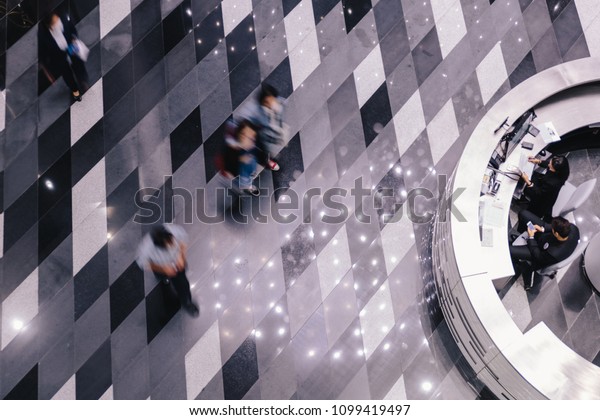 People Walking On Rectangle Pattern Floor Stock Photo 1099419497 ...