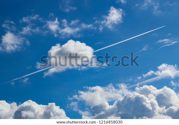 Plane Flying Through Clouds Stock Photo (Edit Now) 1216858030