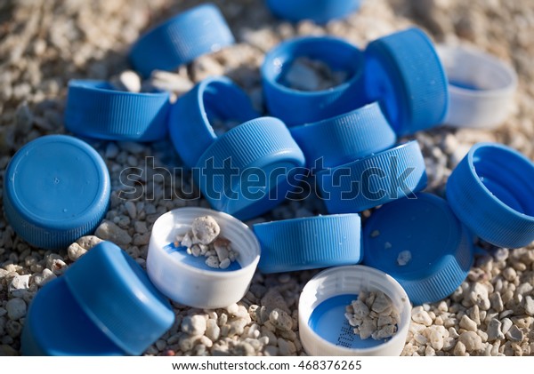 Plastic Bottles Cap On Beach Sand Stock Photo 468376265 | Shutterstock
