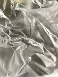 Plastic light reflection filling background. Crumpled cellophane ...