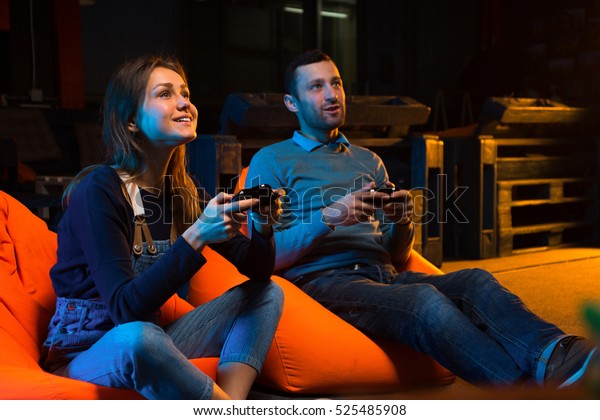 Playing Video Games While Sitting On Stock Photo (Edit Now) 525485908