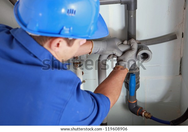 Plumber Installing Pipes库存照片119608906 | Shutterstock