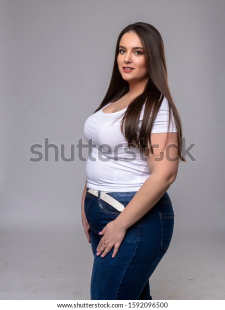 Plus Size Model in studio. side view