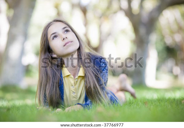 Стоковая фотография 37766977 Portrait Tween Girl Lying On Grass Shutterstock