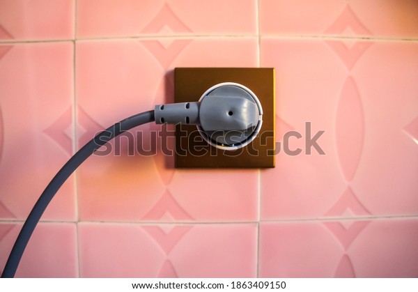Power Socket On Pink Tile Background Stock Photo 1863409150 | Shutterstock