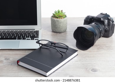 Professional Camera On Work Table Laptop Stock Photo 2148876381 ...