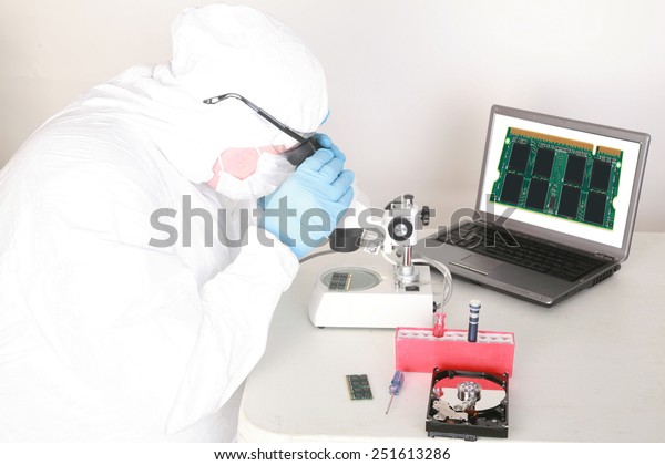 Professional Computer Forensics Technician Examines Computer Stock ...