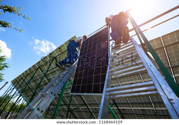 Professional Workers Team Installing Solar Panels Stock Photo ...