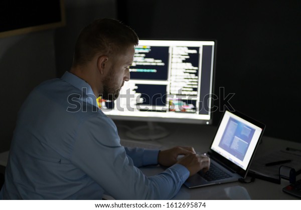Programmer Working Late Night On Multiple Stock Photo 1612695874 ...