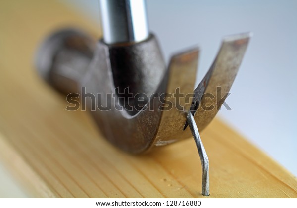 Pulling Out Nail Stock Photo (Edit Now) 128716880