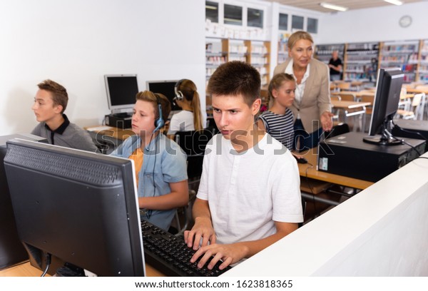 Pupils Using Computers Lesson Teacher Teaching Stock Photo 1623818365 ...