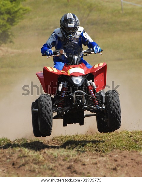 Quad Jumping Stock Photo 31995775 | Shutterstock