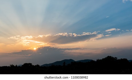 Rays Light Shining Through Clouds Over Stock Photo 1100038982 ...