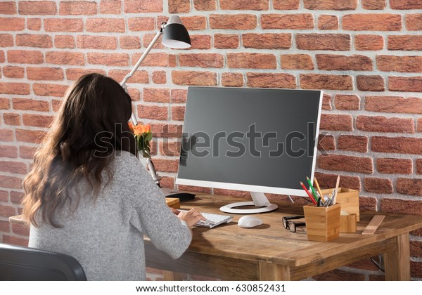 Rear View Woman Using Computer Stock Photo (Edit Now) 630852431 Rear View Woman Using Computer Stock Photo (Edit Now) 630852431