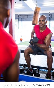 Reflection Man Smiling While Exercising Dumbbells Stock Photo 575472799 ...